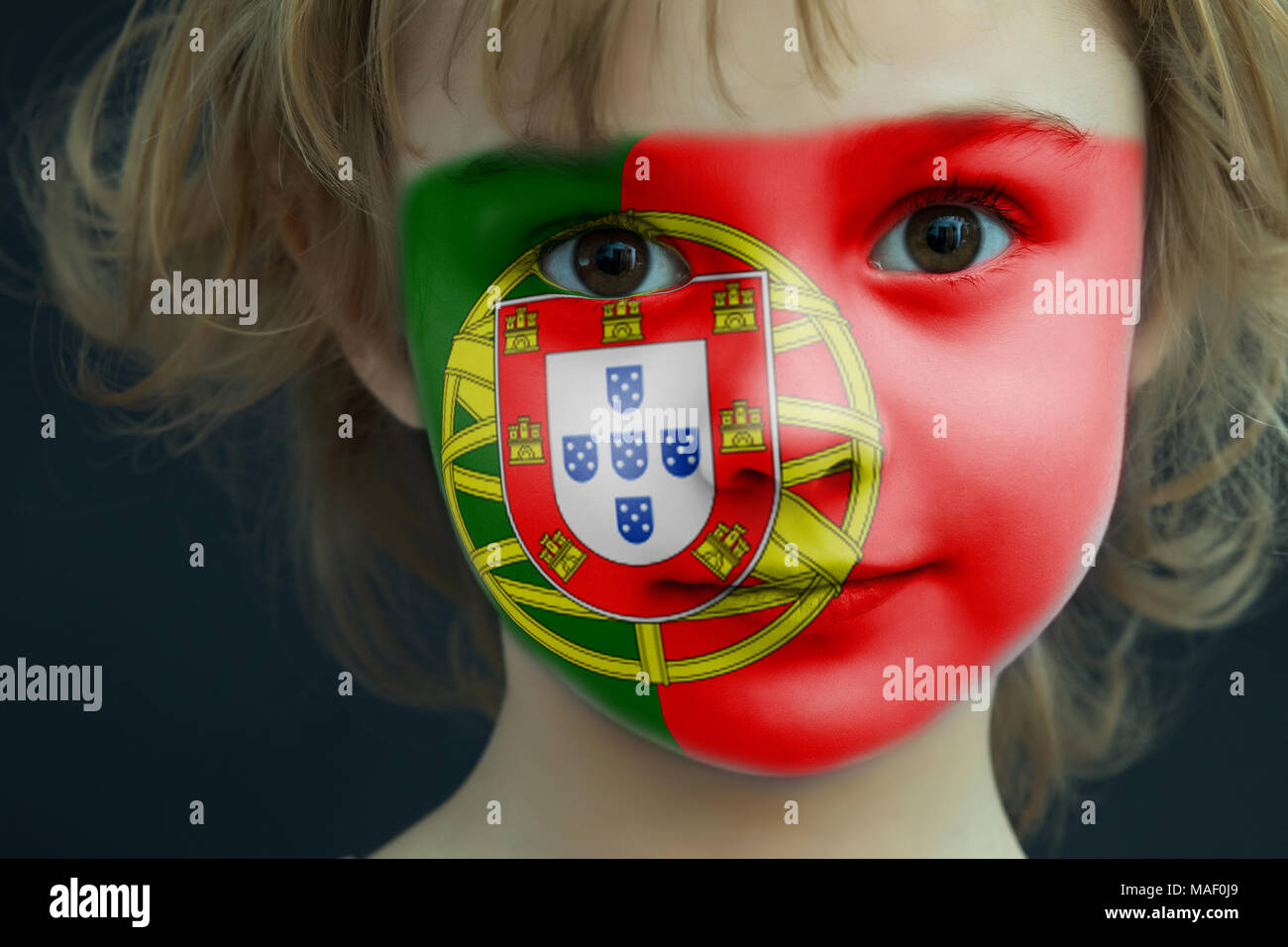 Portrait of a child with a painted Portugal flag Stock Photo - Alamy
