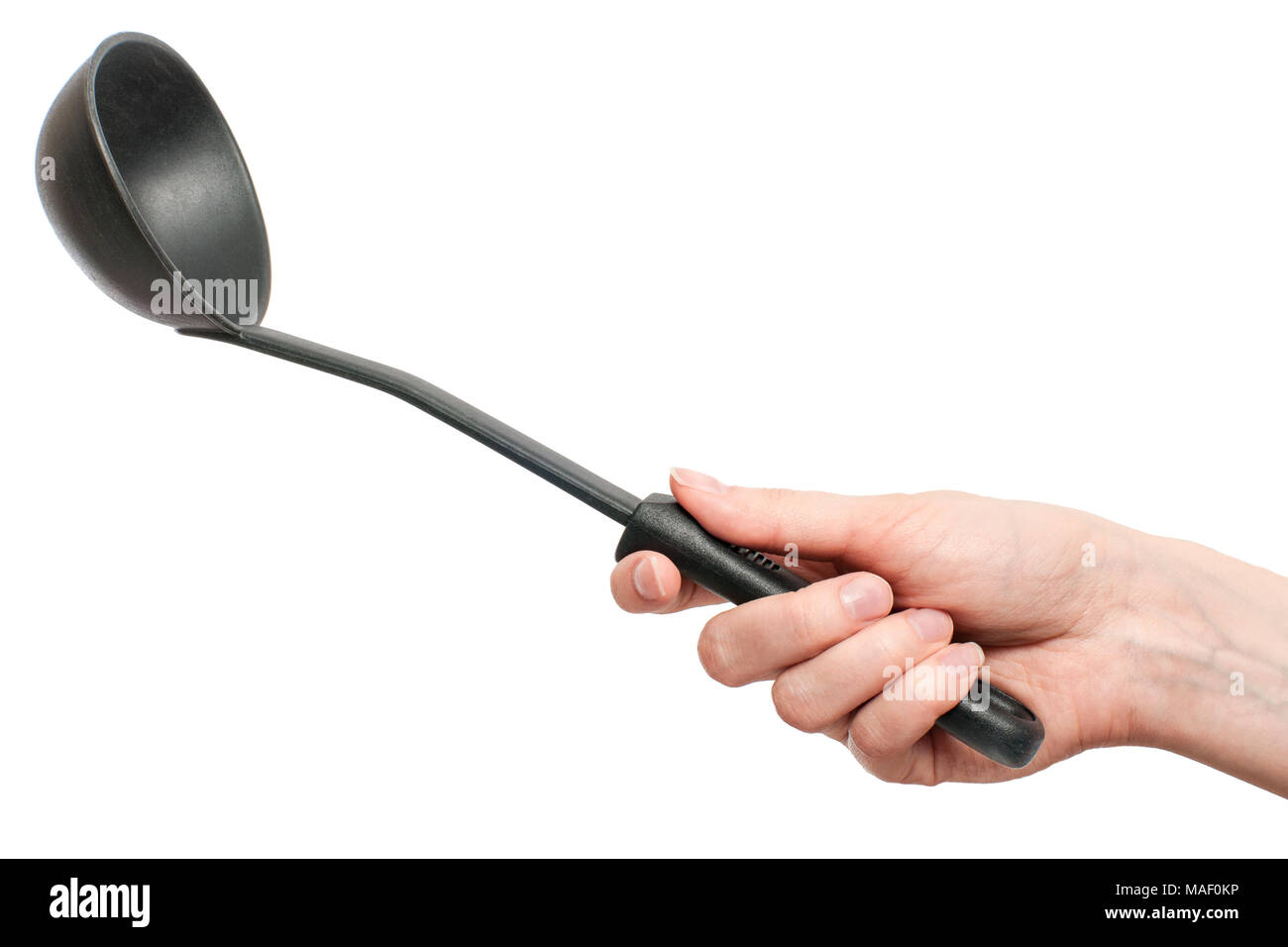 black plastic kitchen ladle in hand isolated on white background Stock ...
