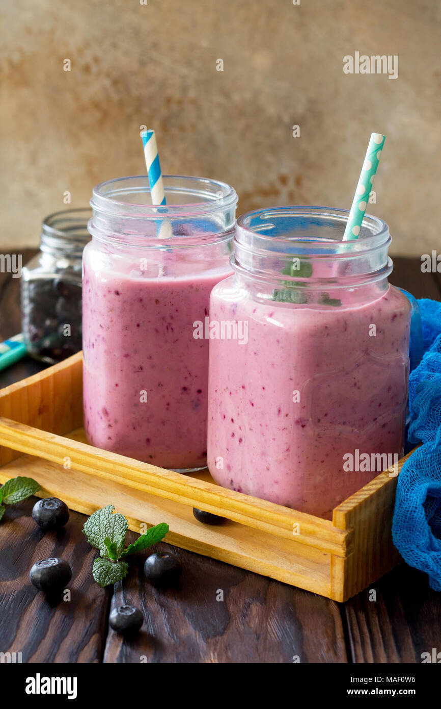 Mason jar mugs with fresh berry cocktails blueberry. Diet, concept of ...
