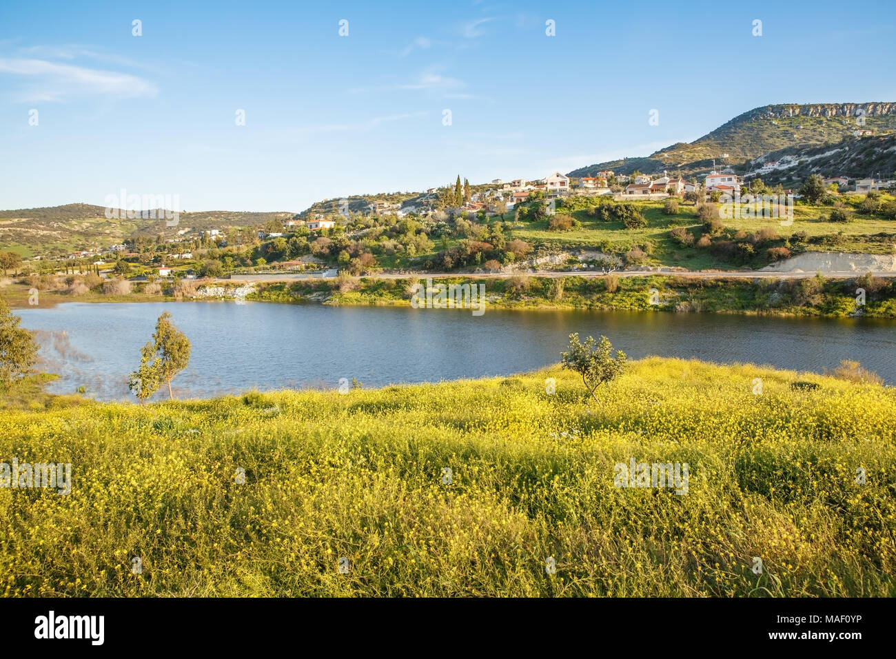 Cyprus landscape with mountains, lake and village Stock Photo - Alamy