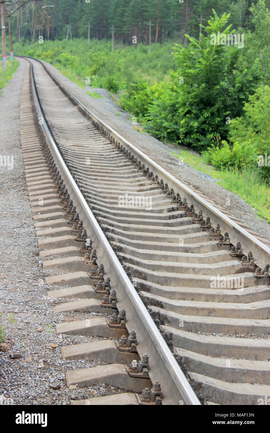 Railroad tracks stretching into the distance for the turn Stock Photo ...