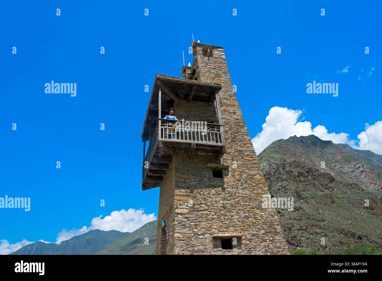 Qiang girl in watch tower in Taoping Qiang Village, Ngawa Tibetan and ...
