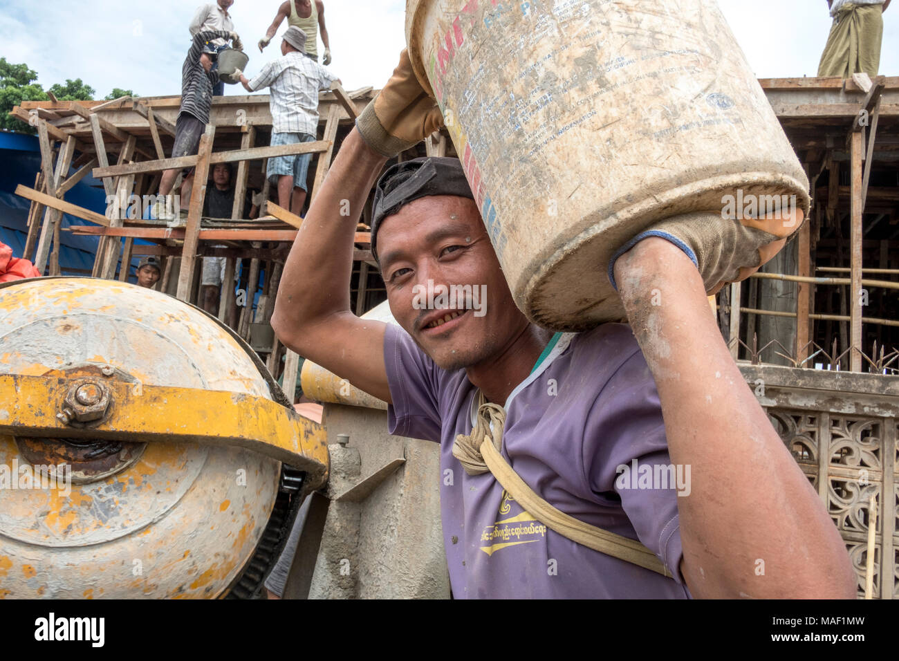 Construction workers on a building site. Lashio, Shan State, Myanmar ...