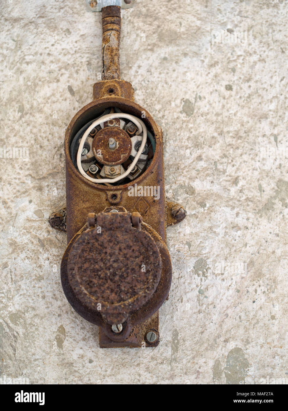 Old electrical fitment. Rusted and beyond use Stock Photo - Alamy