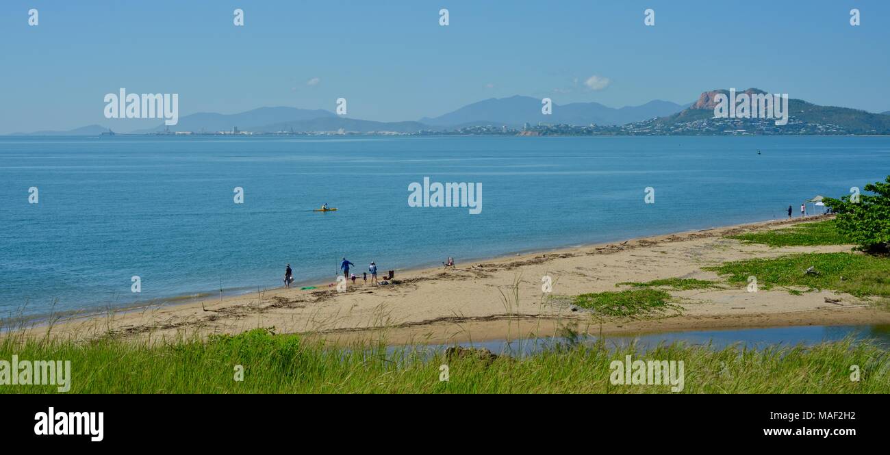 People fishing from the beach with a view of castle hill from ...