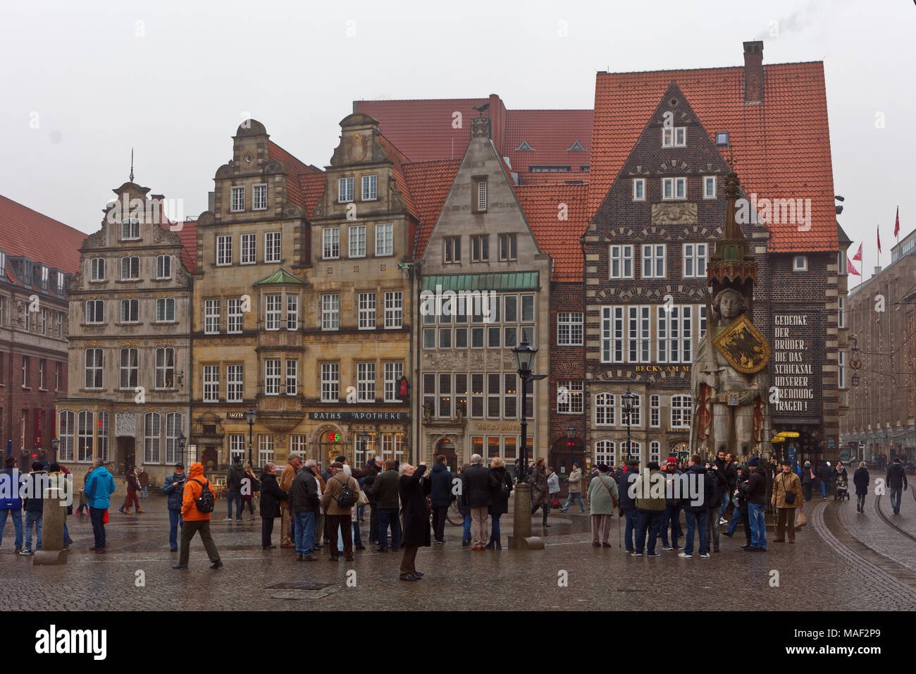 People at the statue of Roland on the Market Square in Bremen, Germany ...