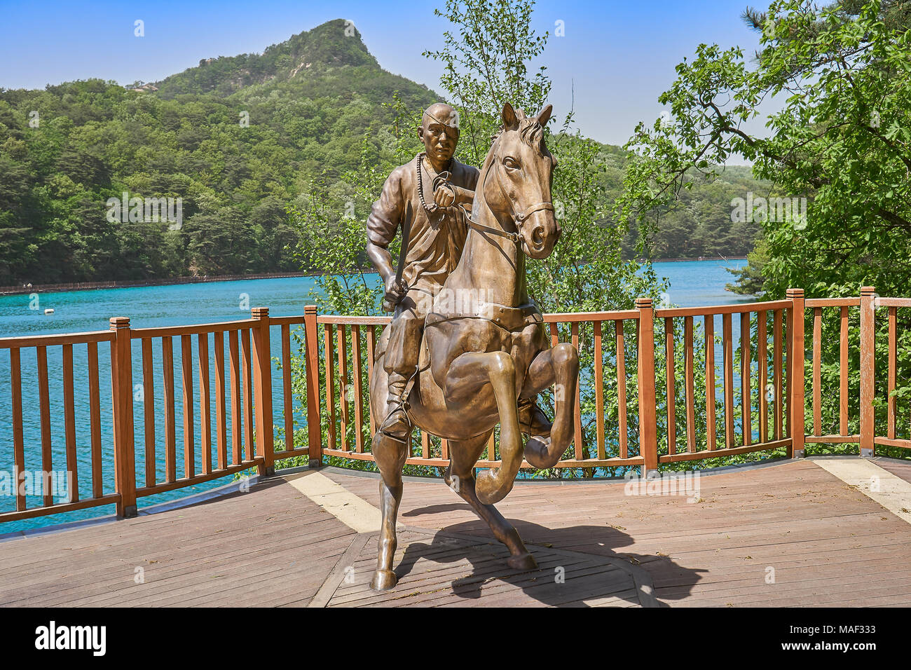 A bronze statue of Gung Ye, king of the short-lived Hugoguryeo of ancient Korea on a wooden ...