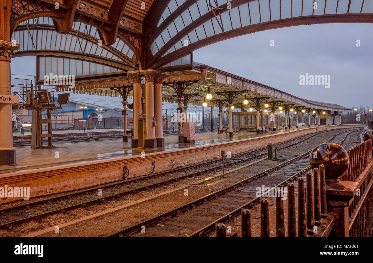 An ornate 19th platform and canopy at York railway station at dawn ...