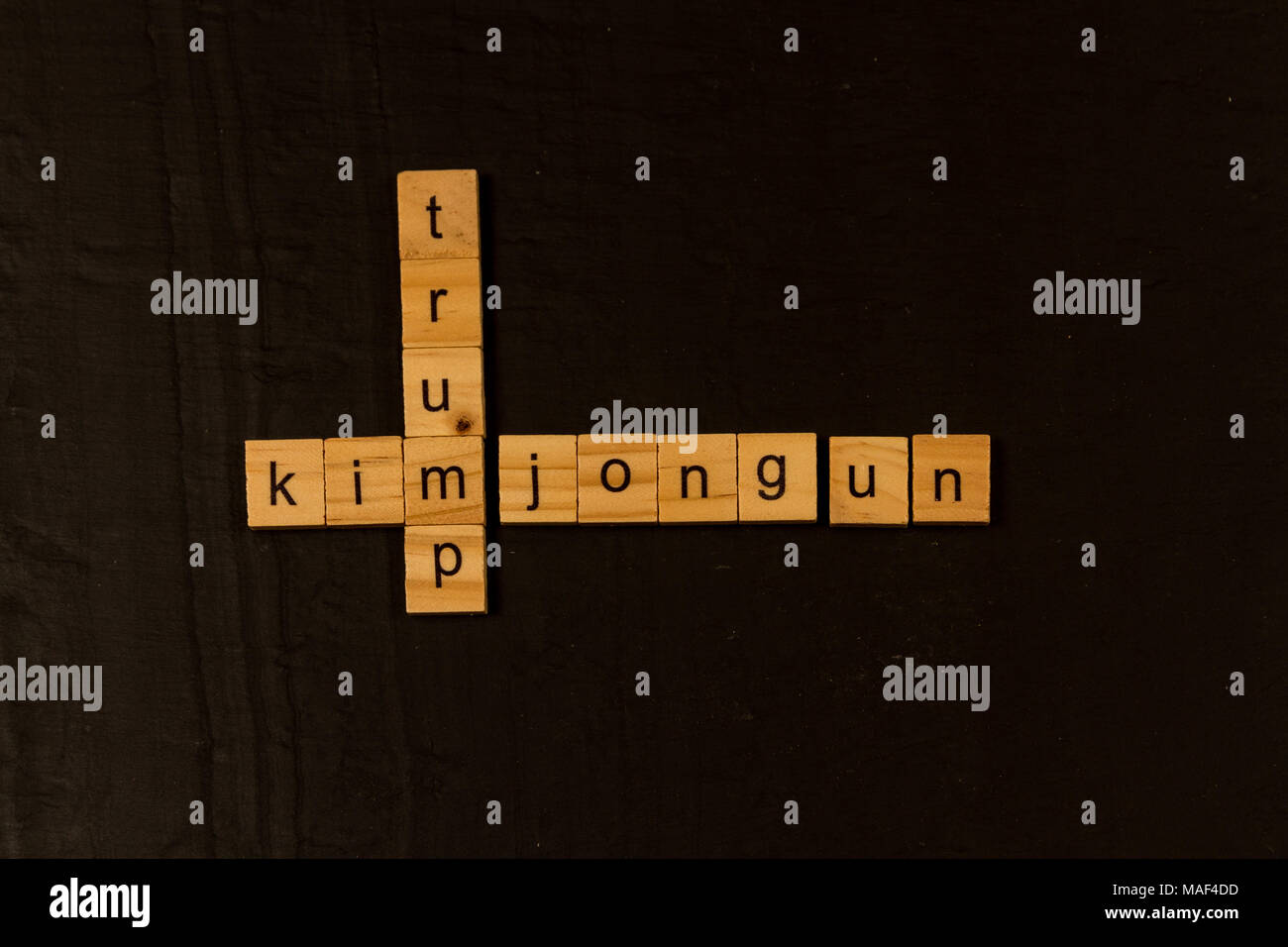 Toy letter blocks showing Trump and Kim Jong Un like a crossword Stock ...