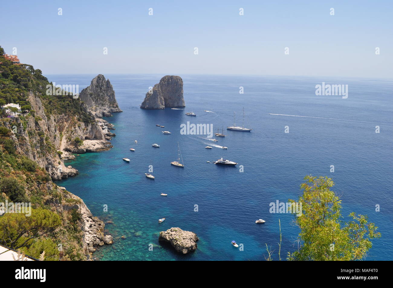 Bay, cliffs and turquoise blue water of Capri island, Italy Stock Photo ...