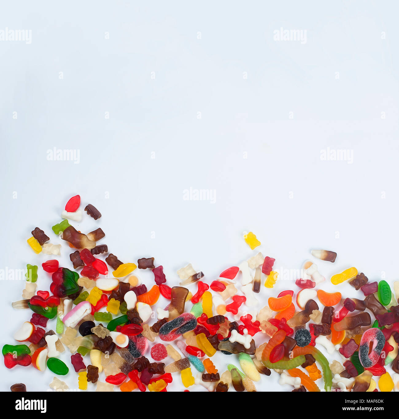 Tasty Mixed colorful sweets jelly Different sorts candy on white ...