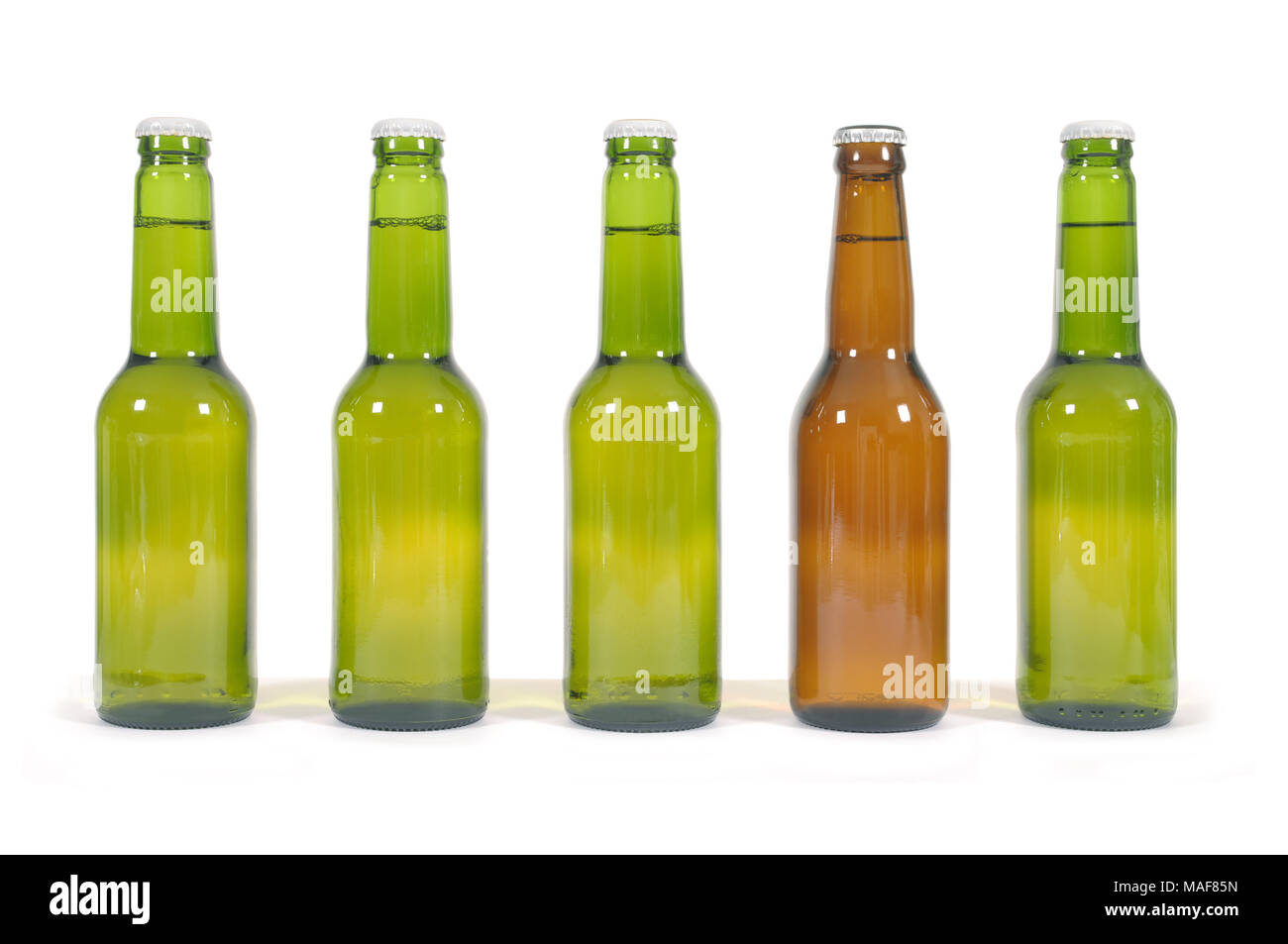 Row of five beer bottles with one different Stock Photo - Alamy
