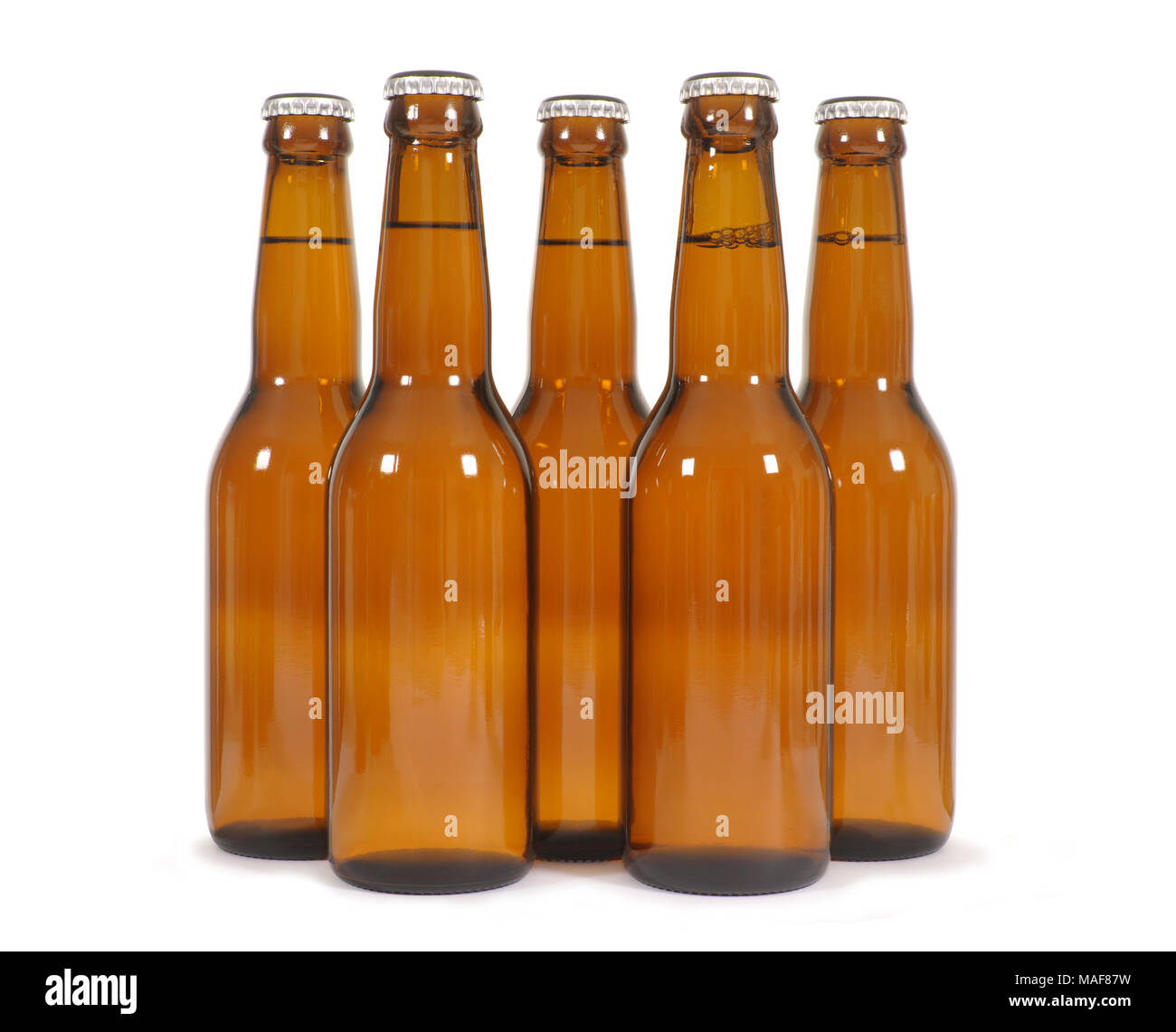 Cluster of brown beer bottles against a white background Stock Photo ...