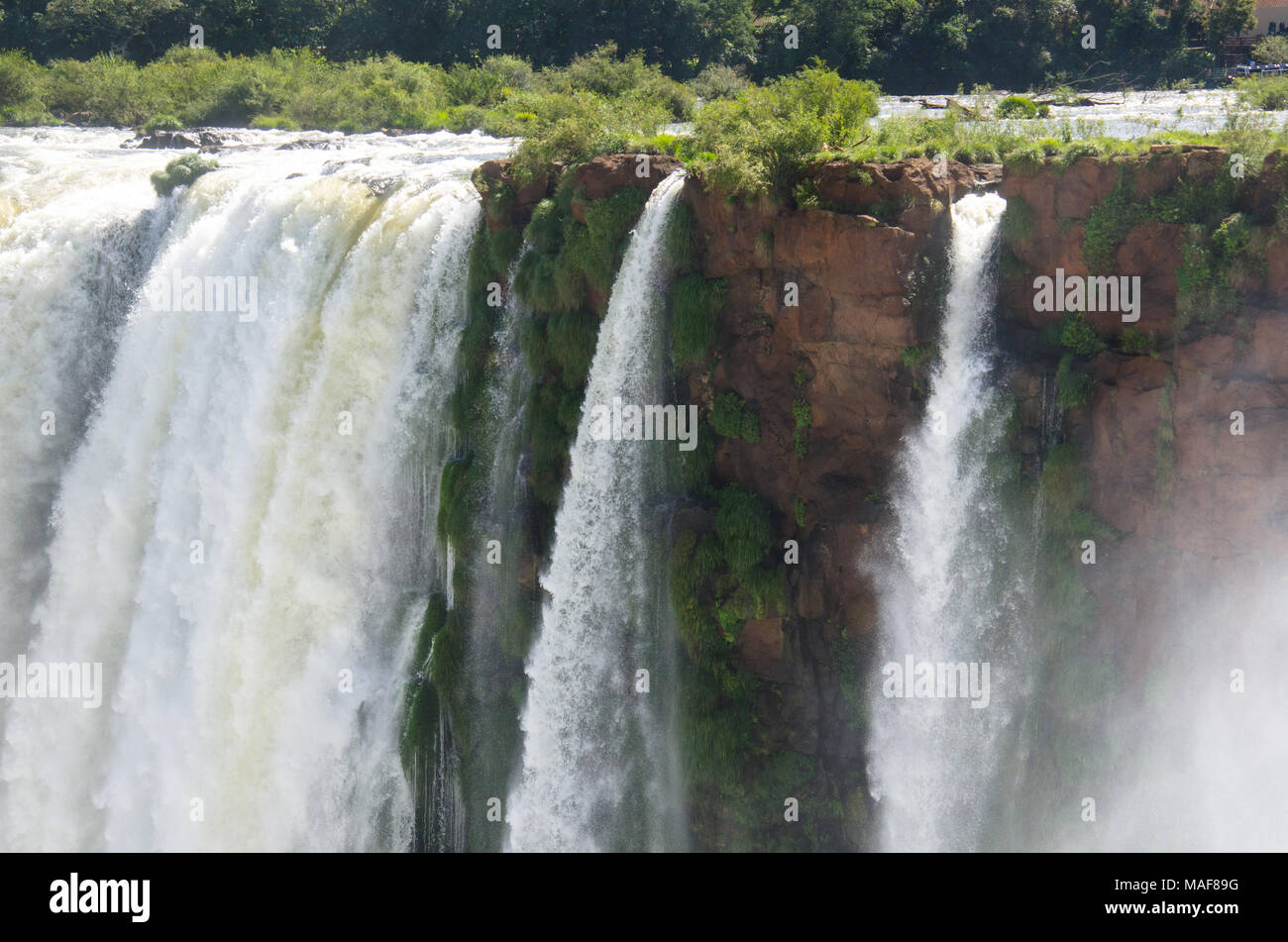 Majestic waterfall. Water dropping over cliff to form powerful ...