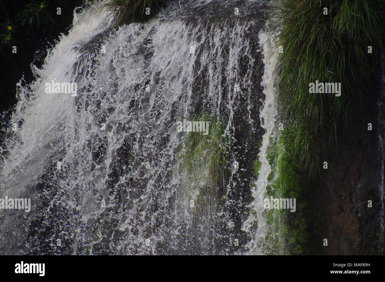Closeup of water cascading down waterfalls. Refreshing water droplets ...