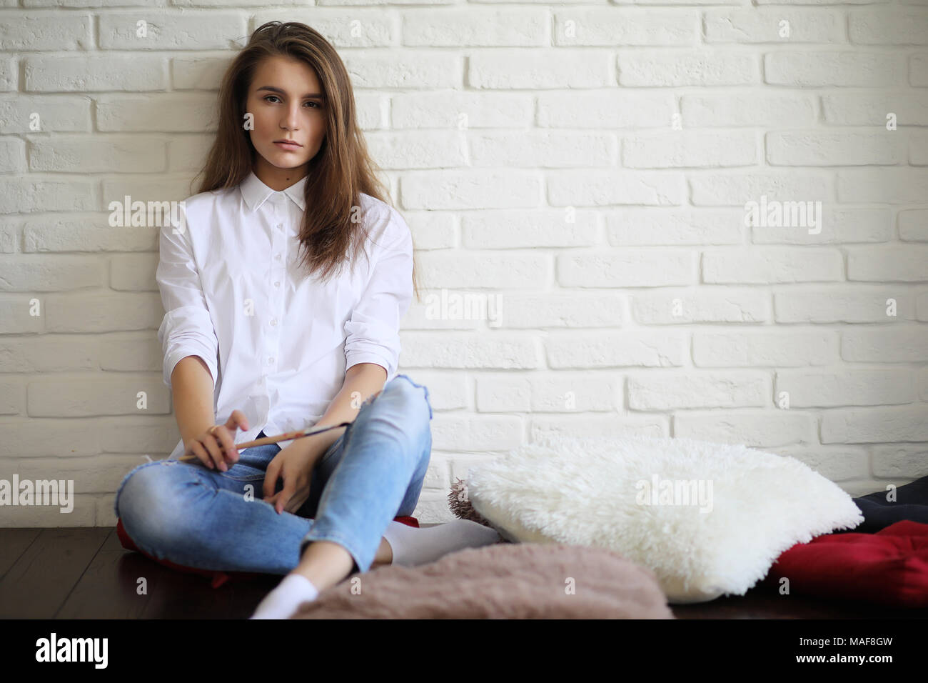 Beautiful girl artist at work in a creative white studio Stock Photo ...
