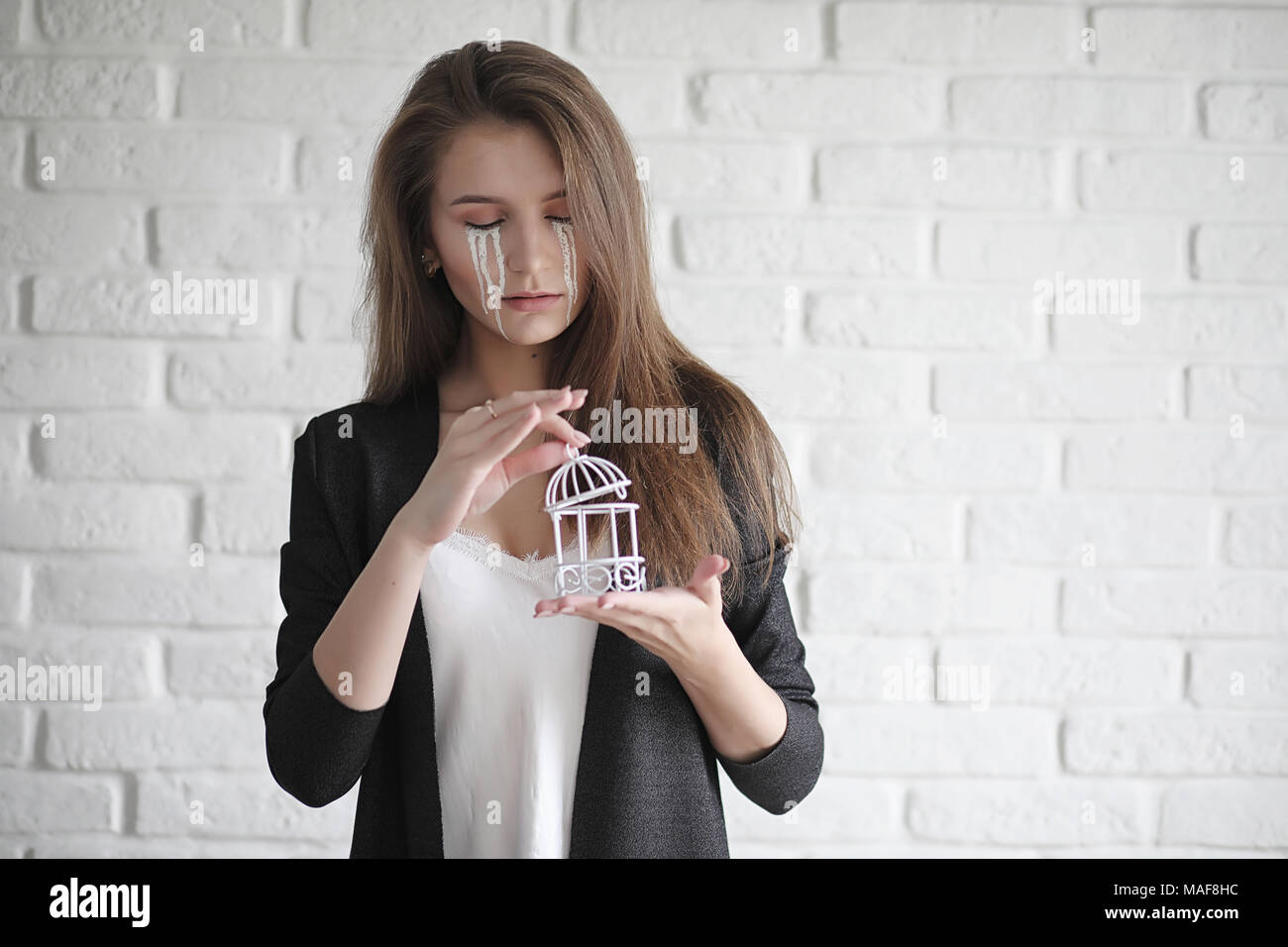 Beautiful girl with tears in eyes. Young girl with painted tears posing ...