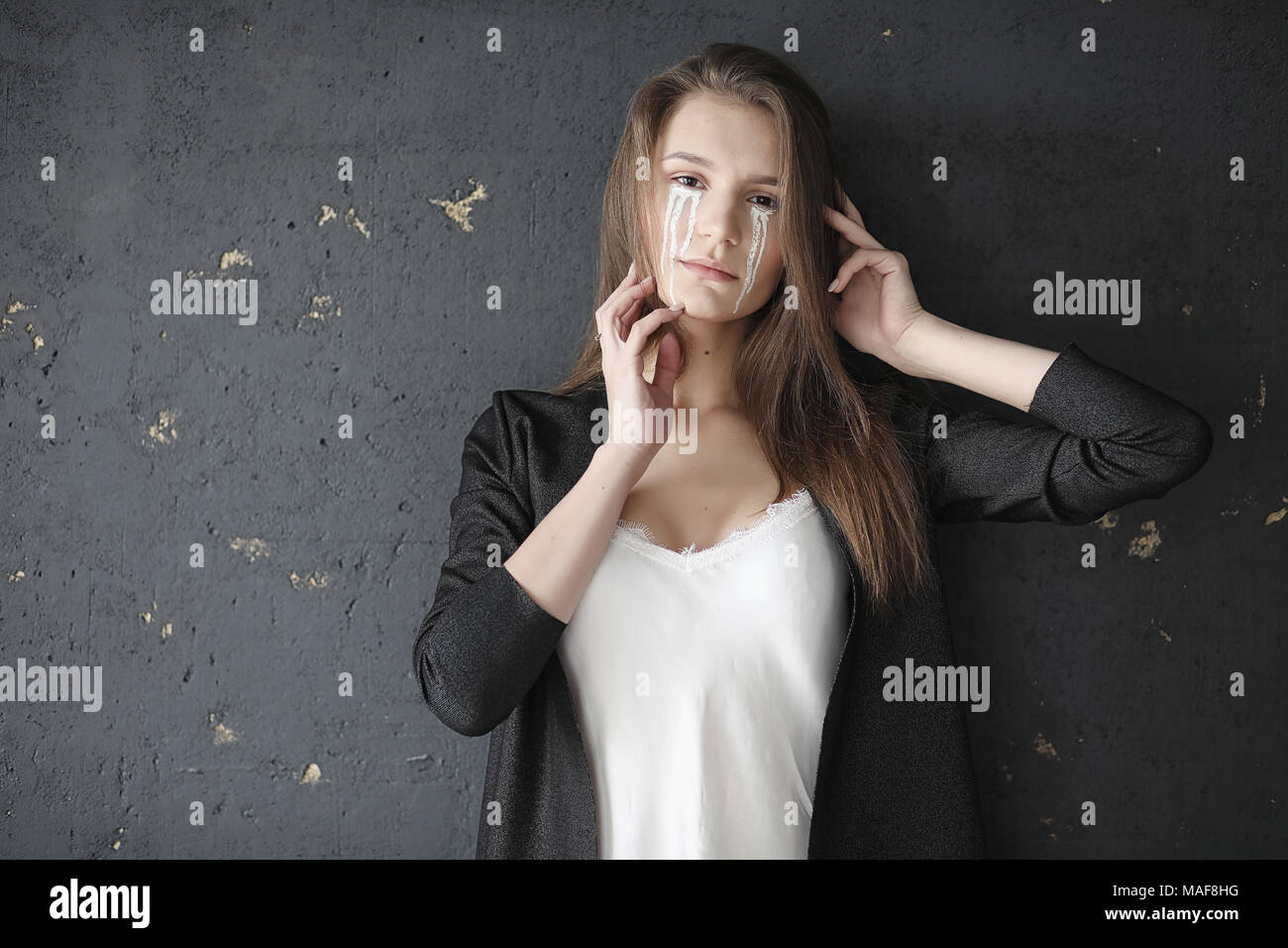 Beautiful girl with tears in eyes. Young girl with painted tears posing ...