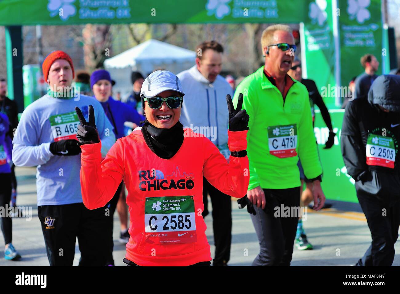 Chicago, Illinois, USA. A happy runner after crossing the finish line ...