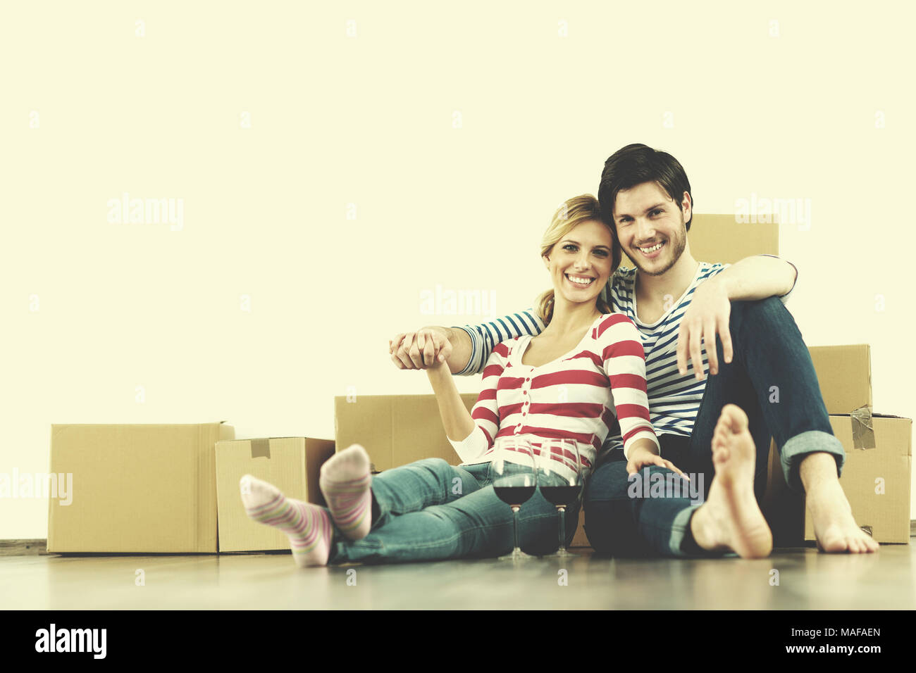 happy Young couple moving in new house Stock Photo - Alamy