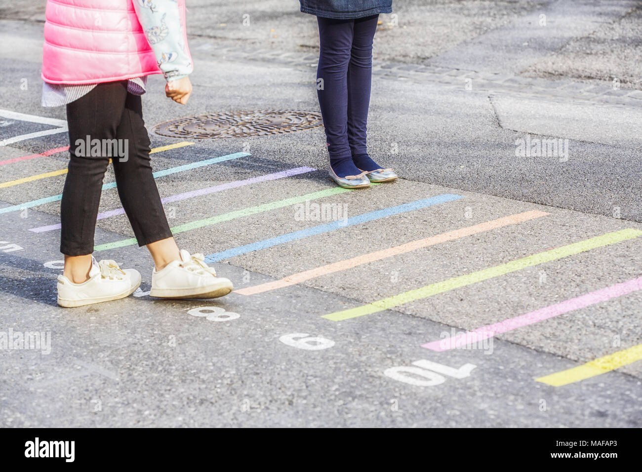 Children playing hopscotch game hi-res stock photography and images - Alamy