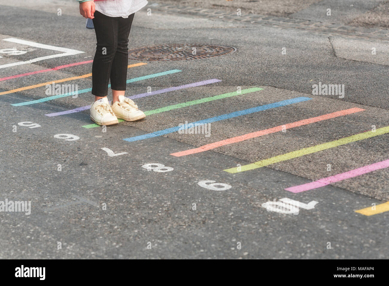 Children playing hopscotch game hi-res stock photography and images - Alamy