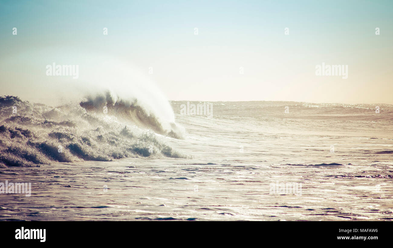 Large powerful wave breaking out to sea in stormy conditions Stock ...