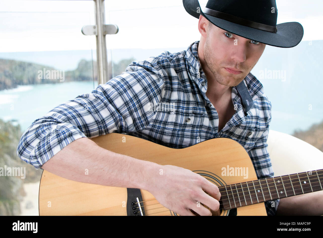Singer with white shirt and white hat hi-res stock photography and ...