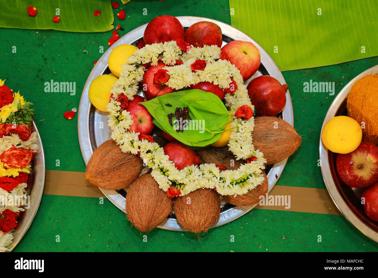 Traditional Hindu wedding ceremony, coconuts and betel leaf Stock Photo ...