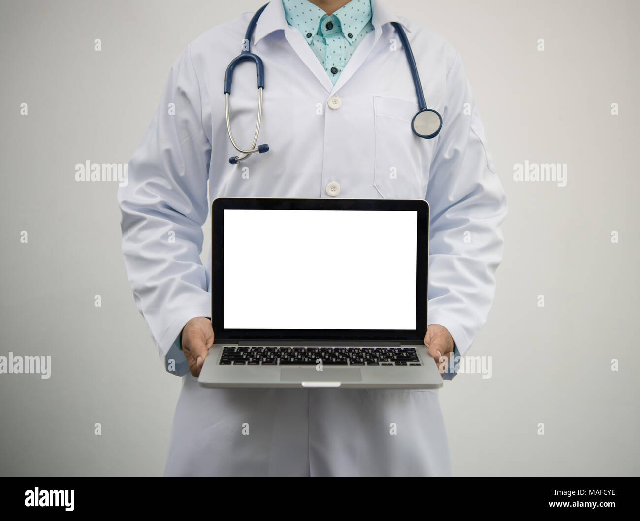 Doctor holding laptop with white blank screen for advertisement Stock ...