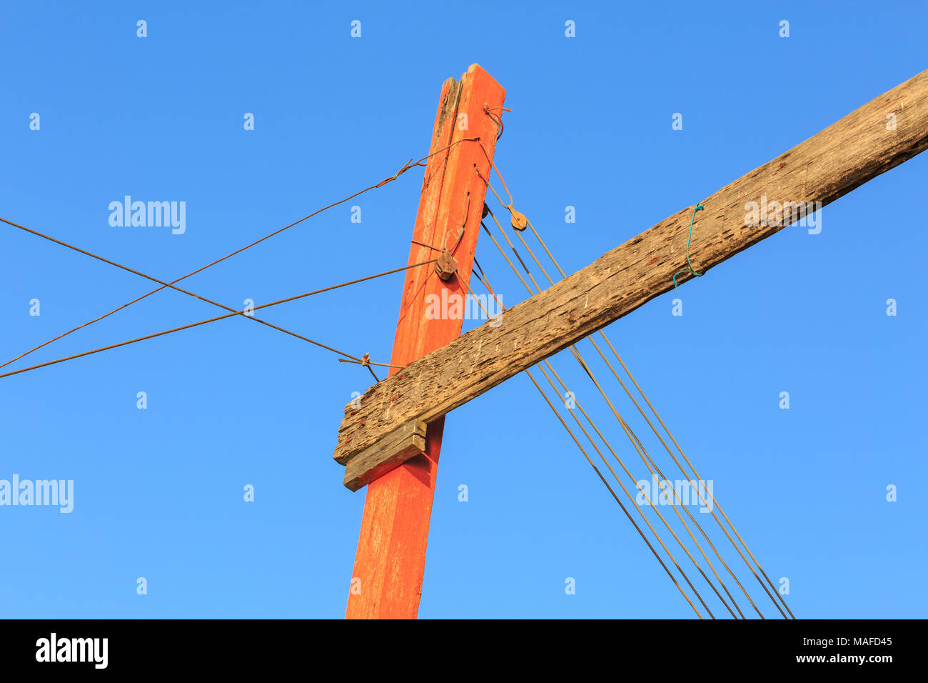 Old wooden poles and winches Stock Photo - Alamy