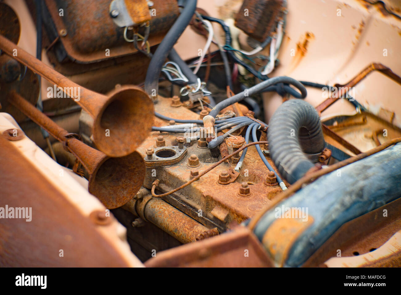 A rusted 184 cu in (3.0 Liter) flathead 6-cylinder engine in a 1955 AMC ...