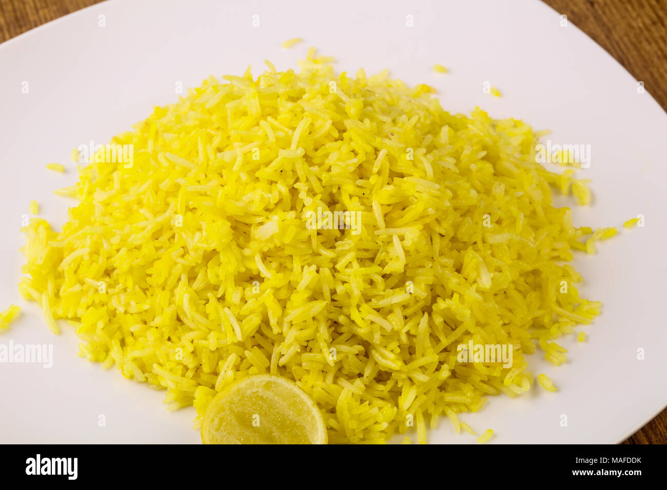 Indian traditional cuisine - Yellow Rice with Lime Stock Photo - Alamy