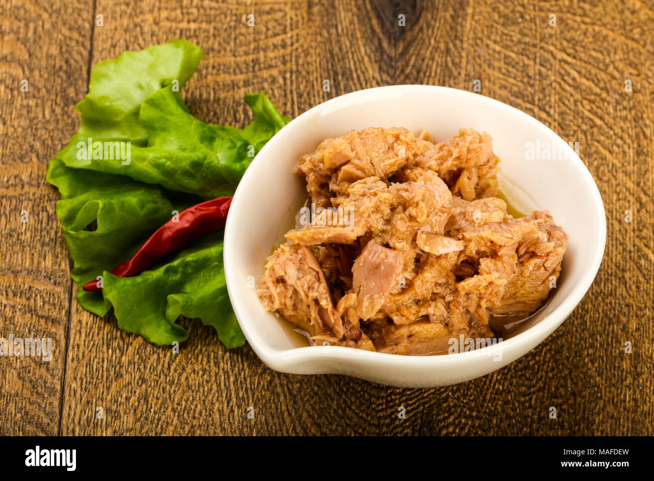 Canned tuna fish in the bowl ready for cooking Stock Photo - Alamy