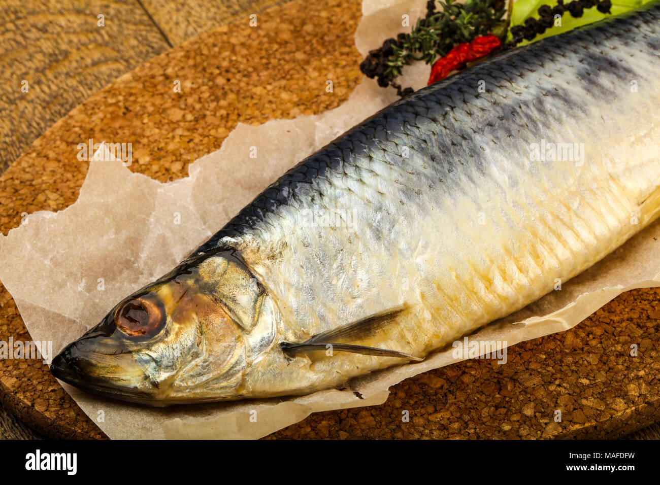 Salted Herring fish with pepper and spices Stock Photo - Alamy