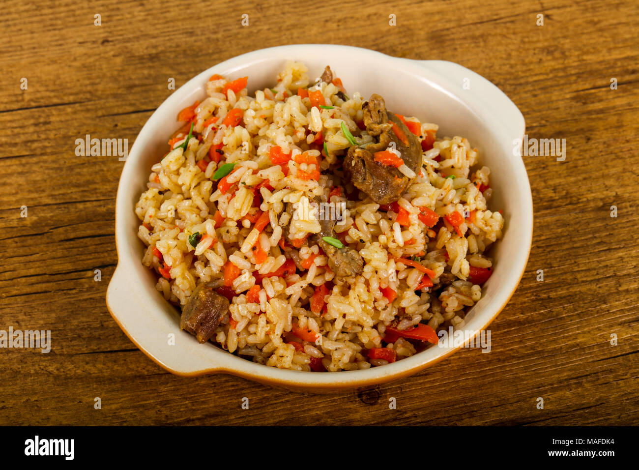 Asian rice - Plov with meat and carrot Stock Photo - Alamy