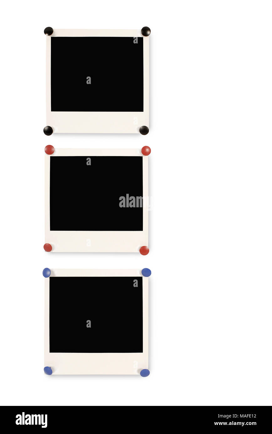 Three blank instant camera photo prints with blue and red pushpins ...