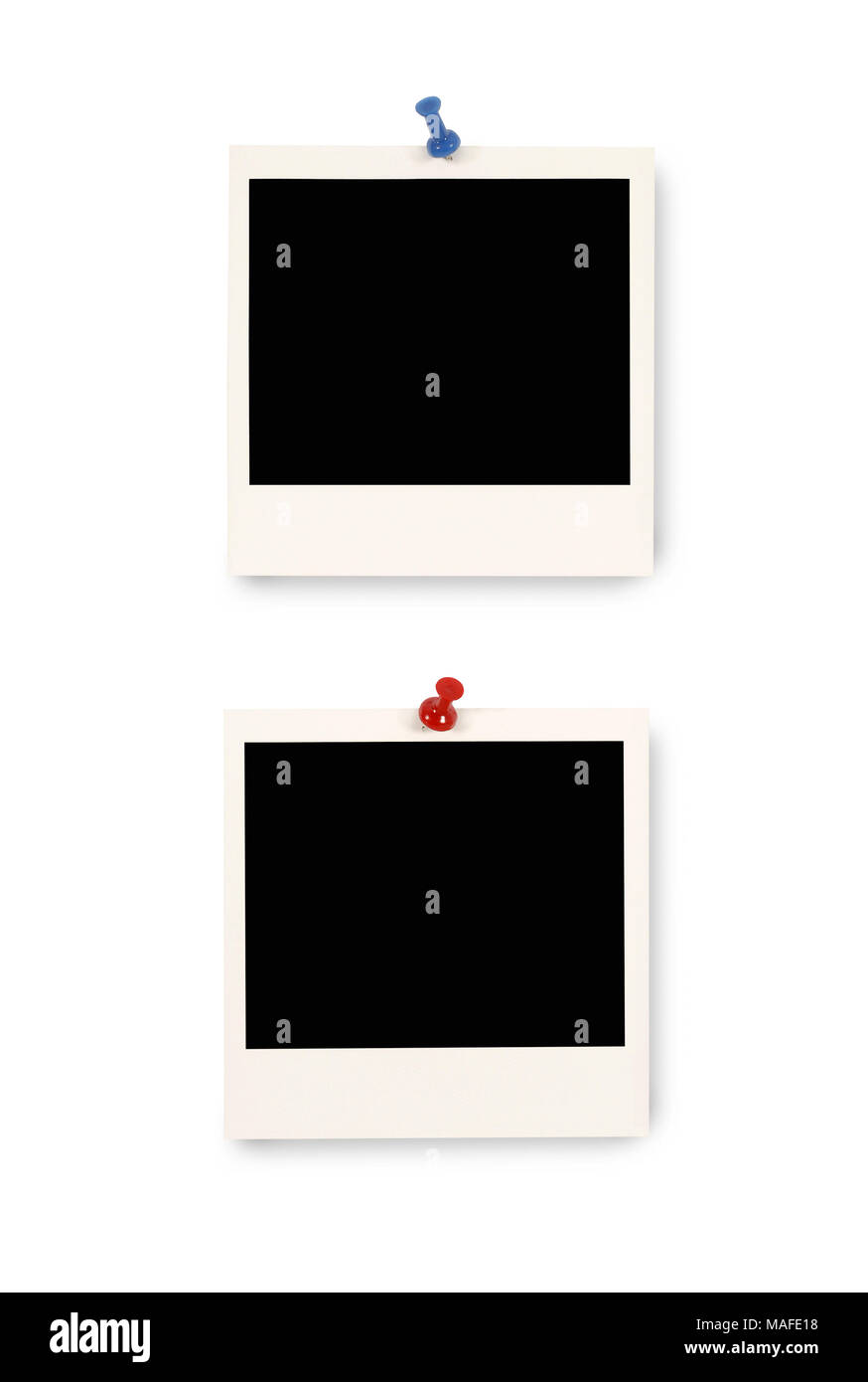 Two blank instant camera photo prints with blue and red pushpins ...