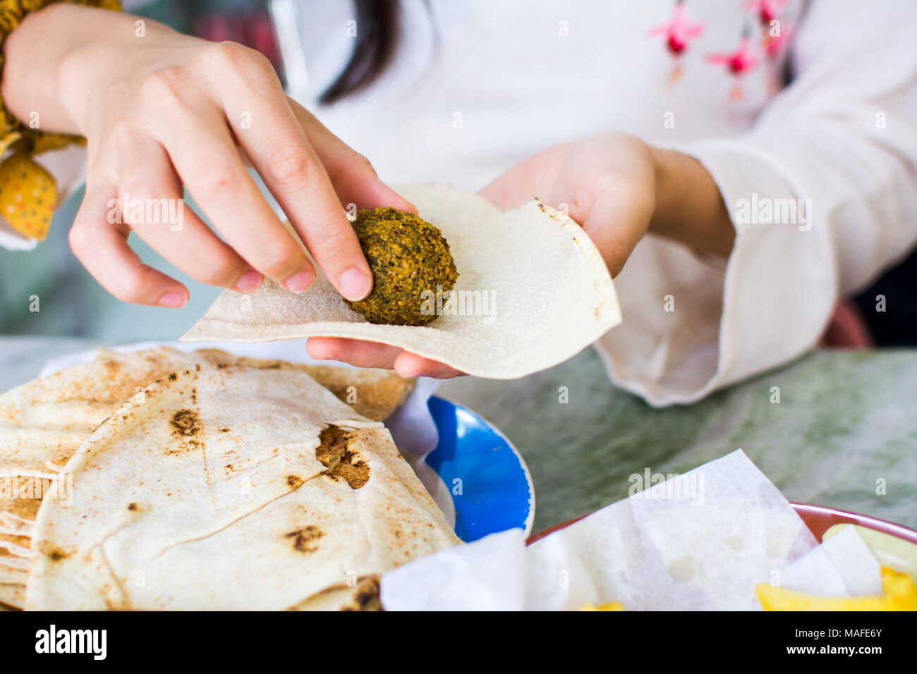 Woman eating traditional food in hi-res stock photography and images ...