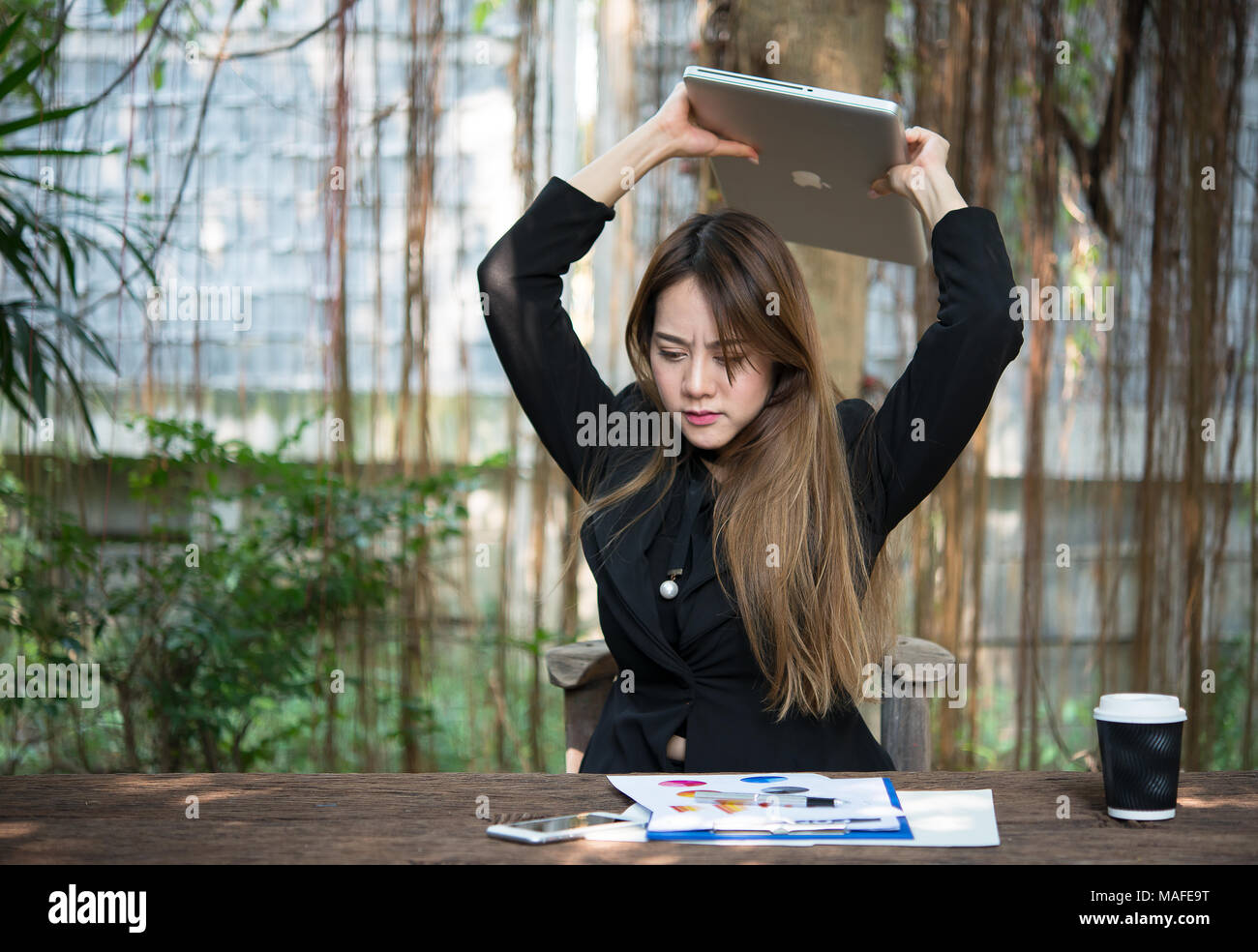 Young business woman get angry with her work Stock Photo - Alamy