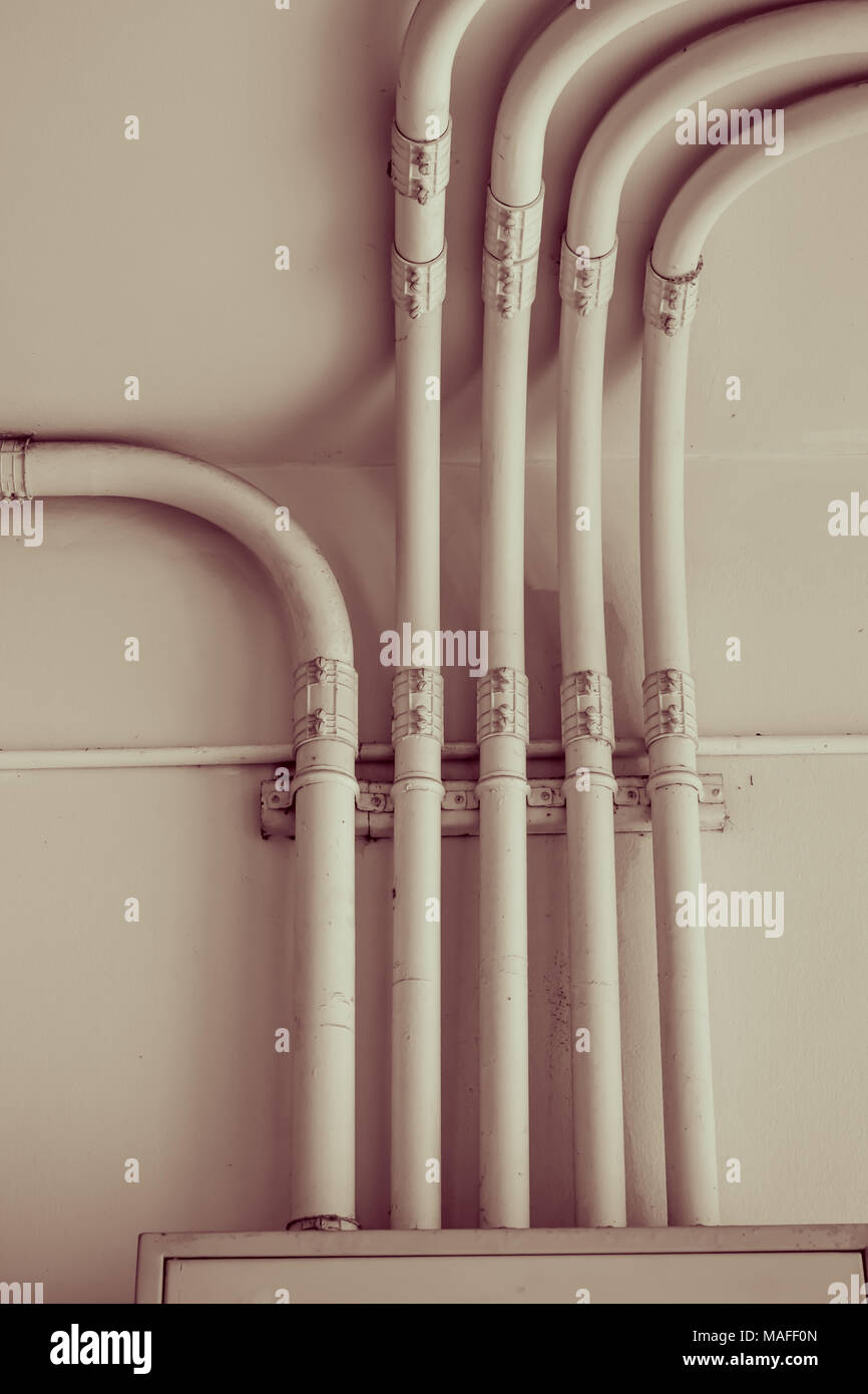 Pipe of electricity line on cement wall in black and white tone Stock ...