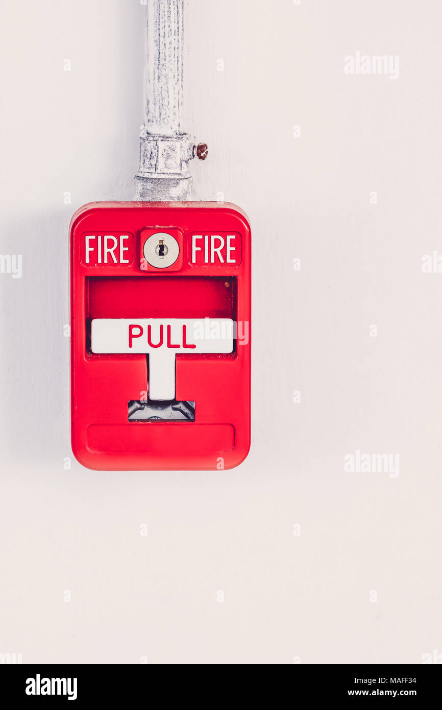 Old red box fire alarm isolated on white background Stock Photo - Alamy