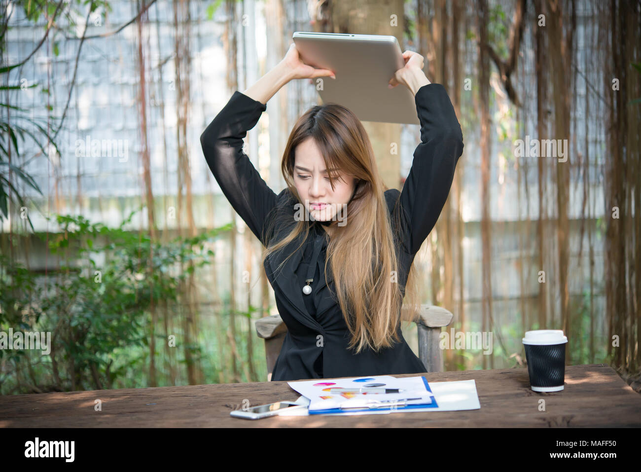 Business Woman getting crazy with of her laptop Stock Photo - Alamy