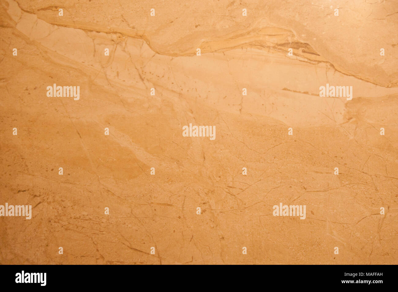 A close up of polished amber marble, suitable for use as background or ...