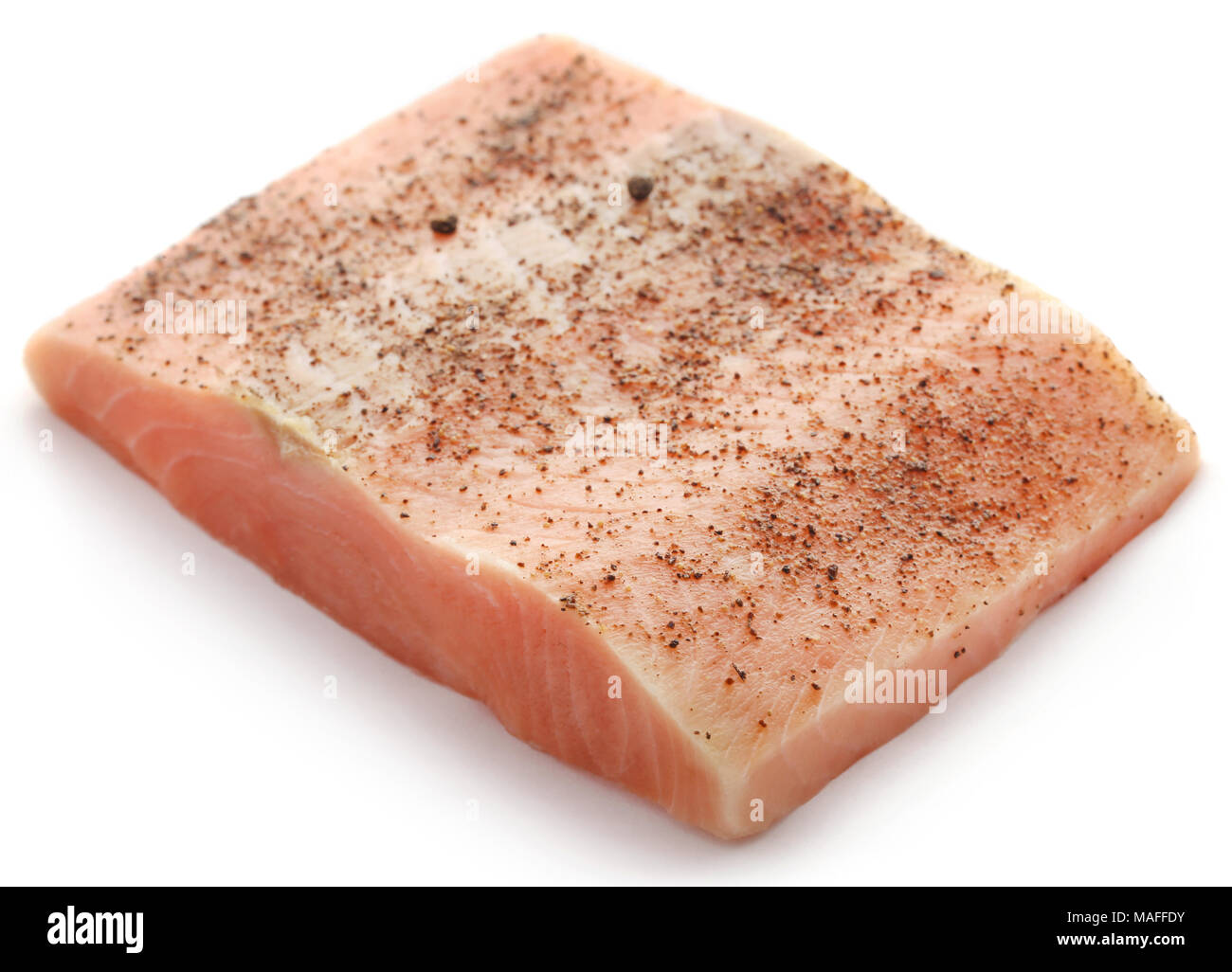 Uncooked salmon fish on over white background Stock Photo - Alamy