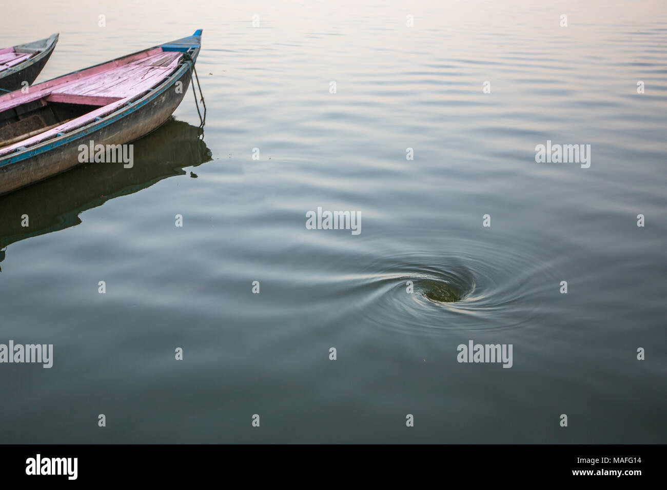 Funnel whirlpool in the water of the Ganges river, Varanasi, India ...