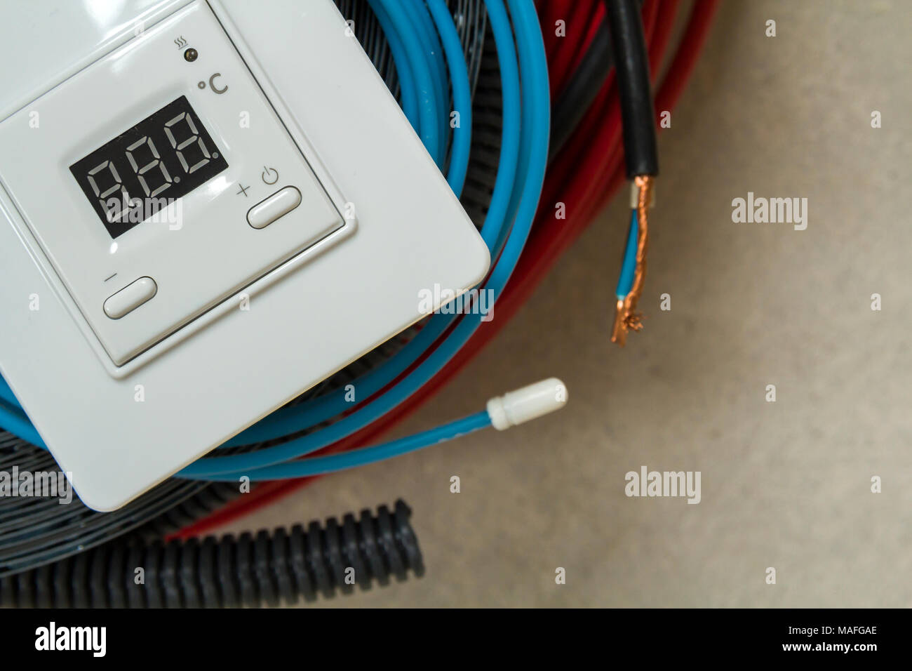 Heating floor system wires, cables and control panel. Renovation and ...