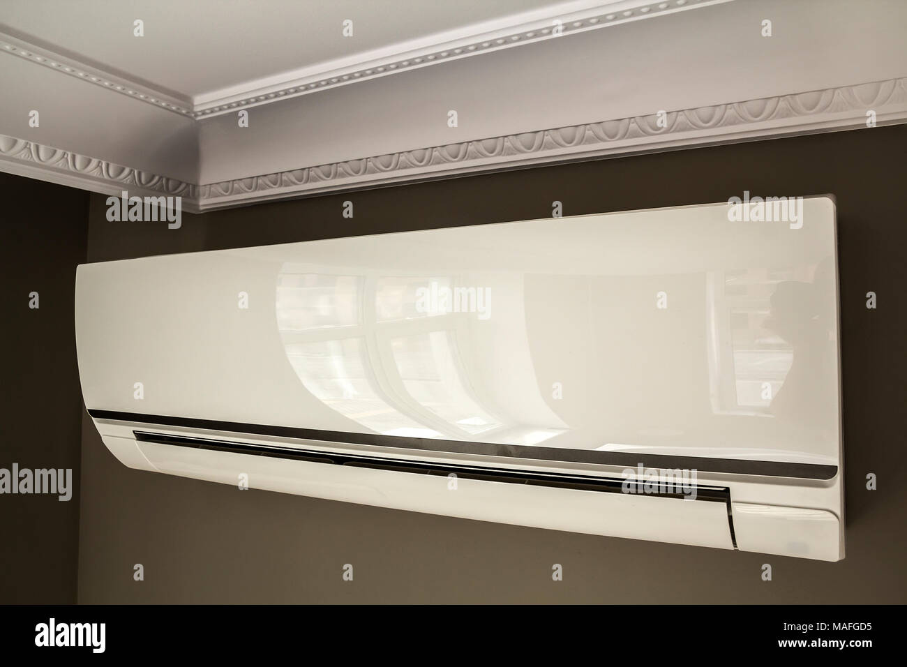 Cool air conditioner system on dark wall in room interior Stock Photo ...