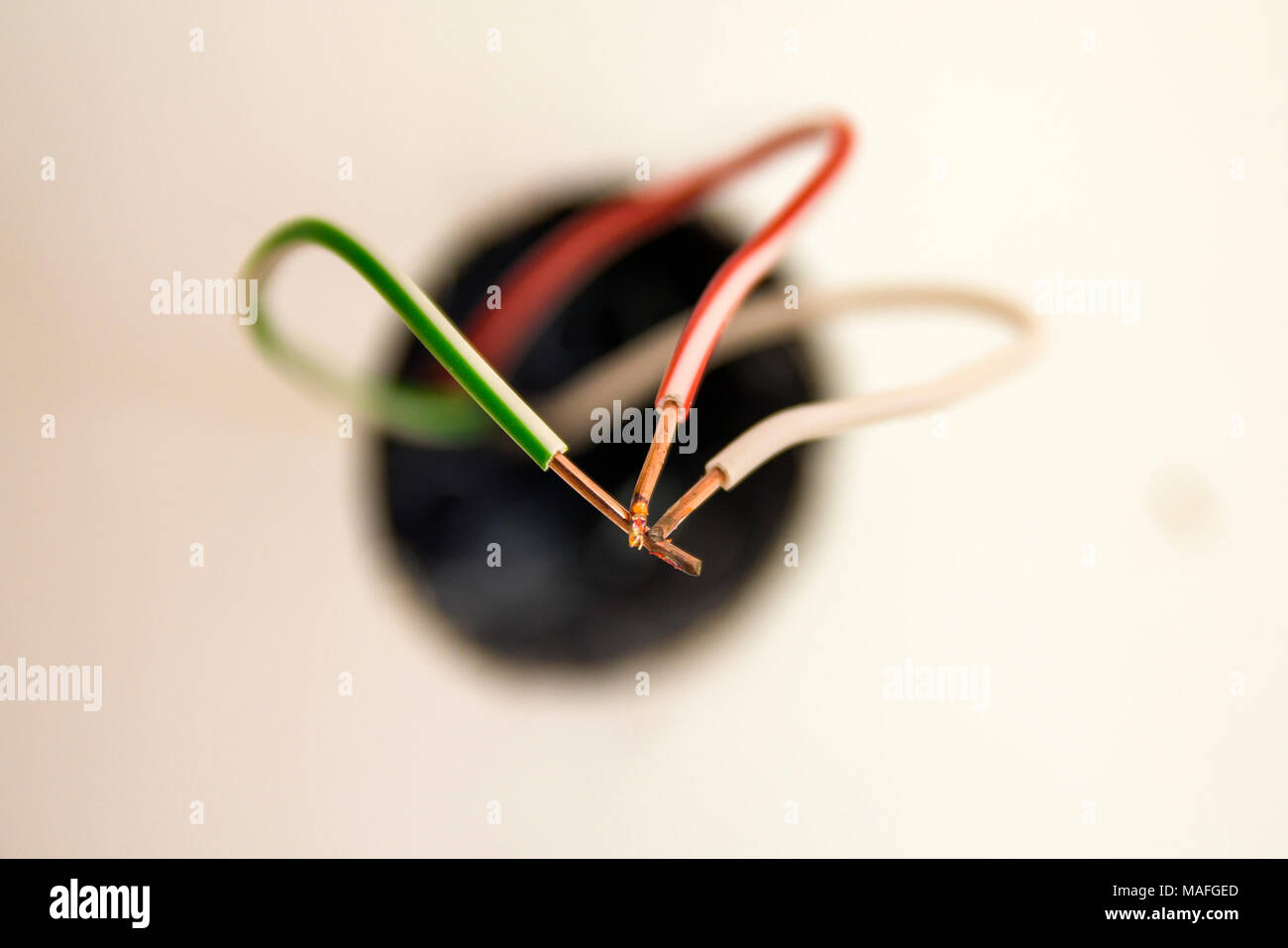 Badly wired plug electric wires showing bad and wrong dangerous ...