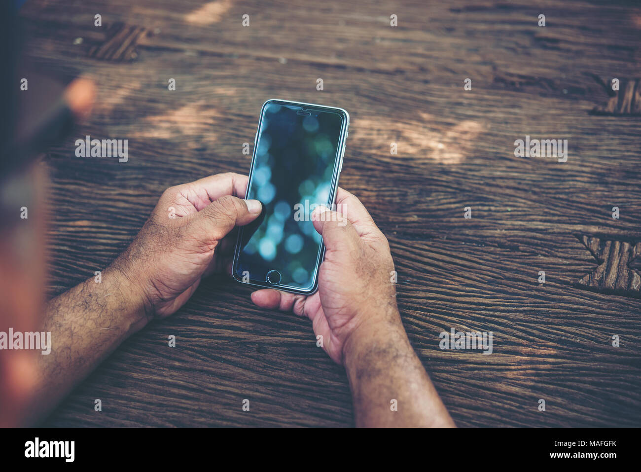 hand holding smart phone and play something Stock Photo - Alamy